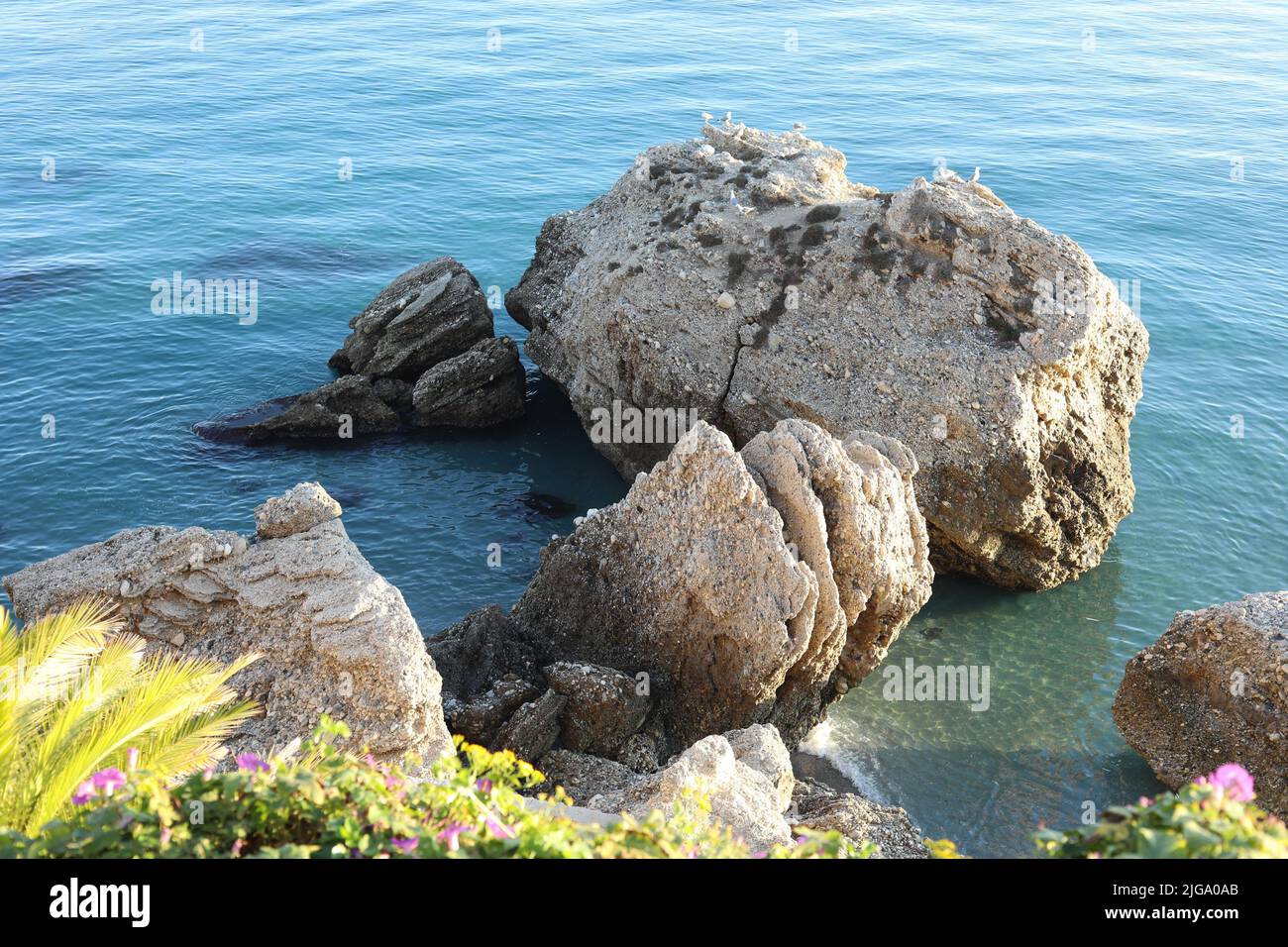 Hidden beach by the ocean sea with natural caves, sand and cliff Stock ...