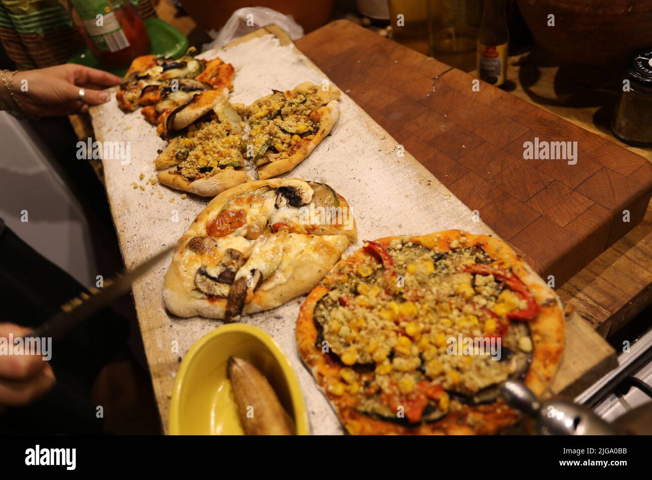 Homemade pizza in wooden fire in open construction. All ingredients ...