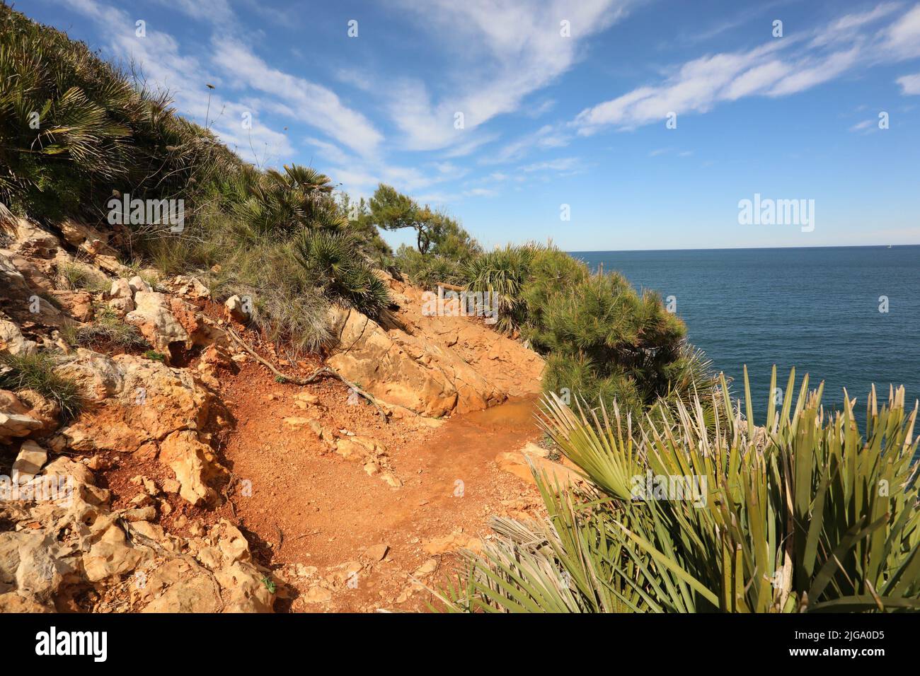 Hidden beach by the ocean sea with natural caves, sand and cliff Stock ...