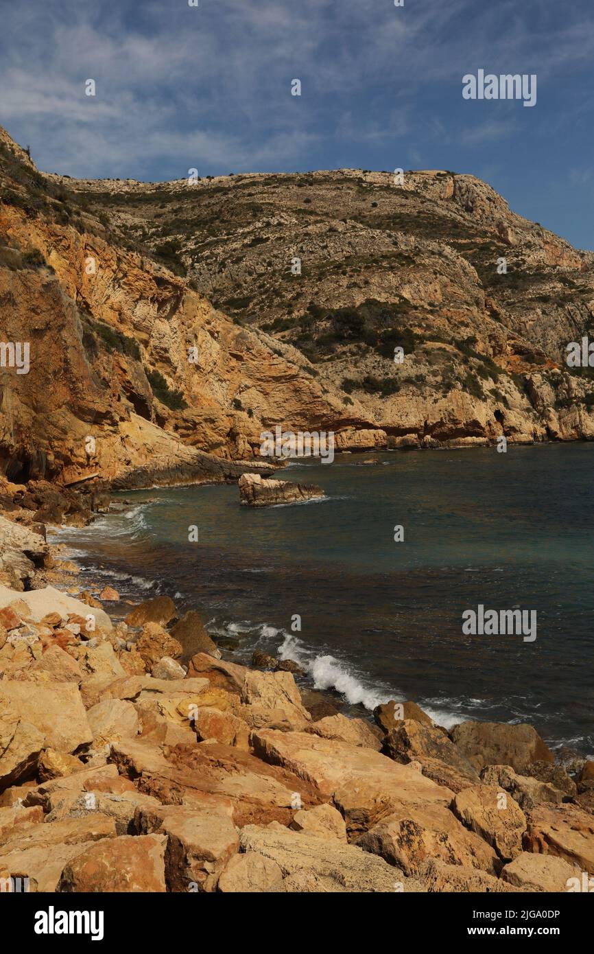 Hidden beach by the ocean sea with natural caves, sand and cliff Stock ...