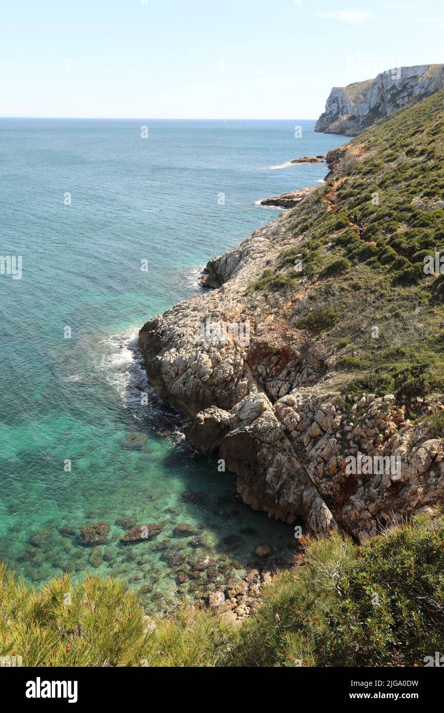 Hidden beach by the ocean sea with natural caves, sand and cliff Stock ...