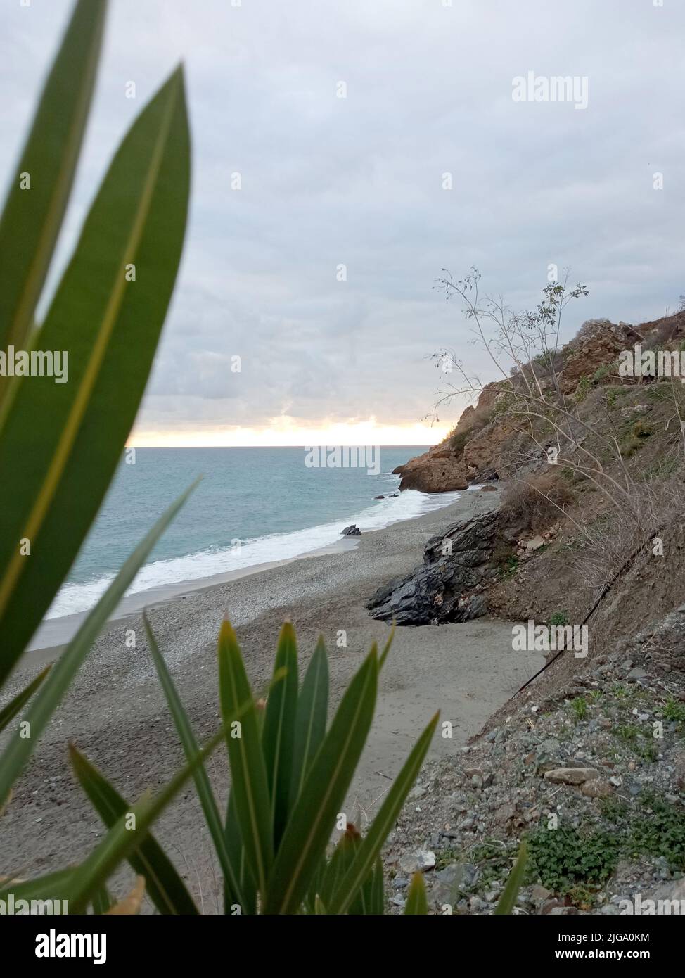 Hidden beach by the ocean sea with natural caves, sand and cliff Stock ...