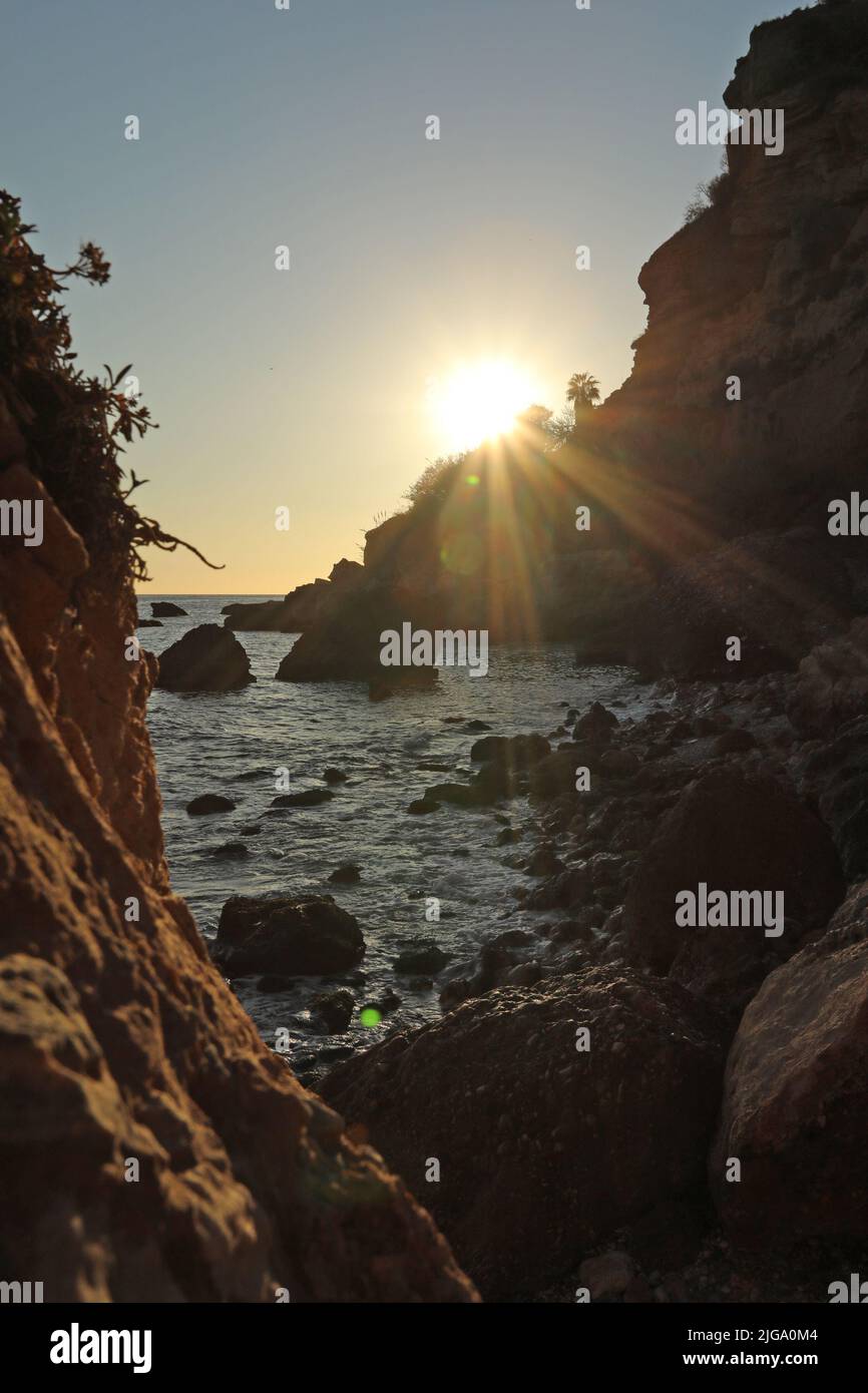 Hidden beach by the ocean sea with natural caves, sand and cliff Stock ...