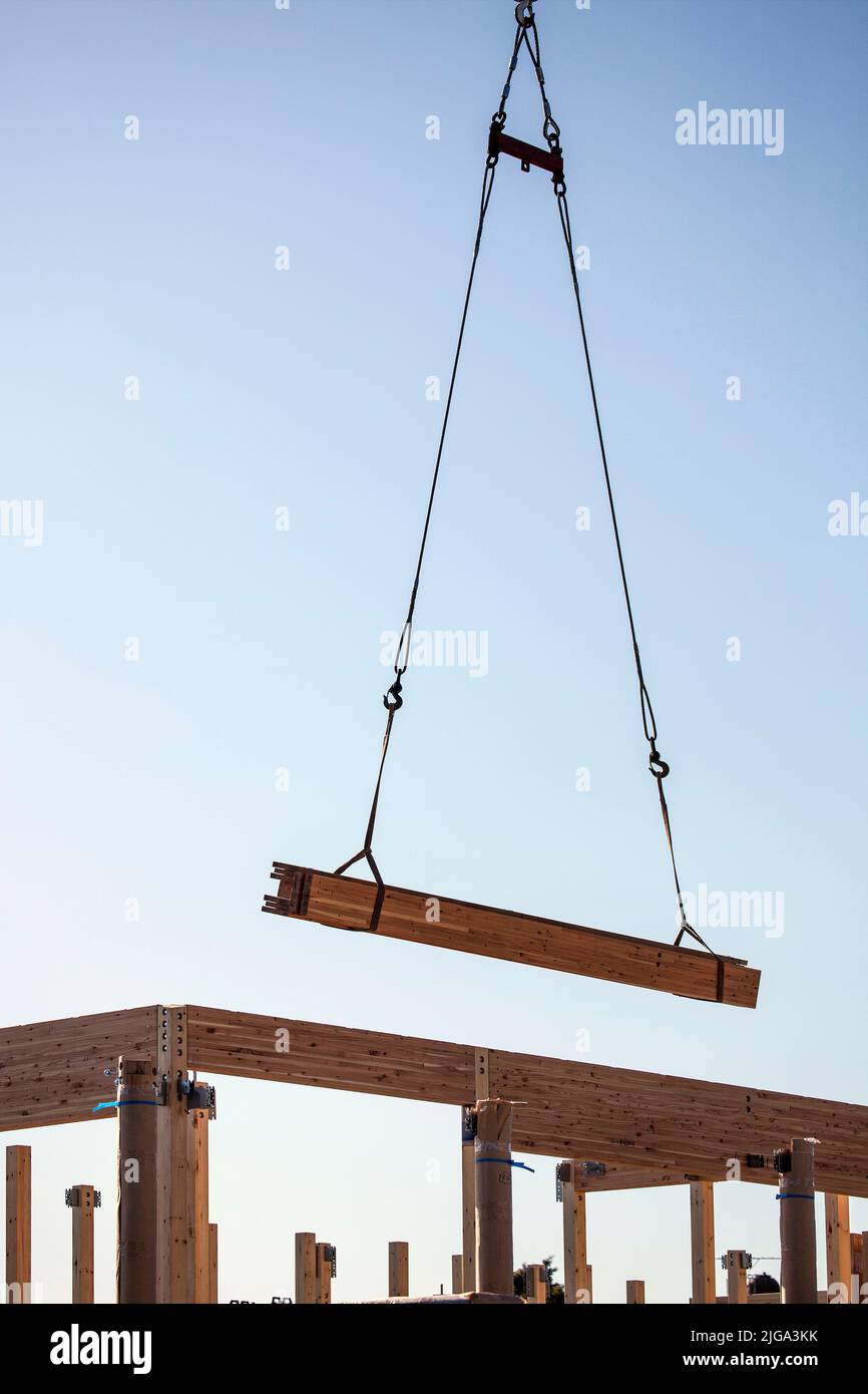 Crane lowers beam at building site in Ikegami,Tokyo, Japan Stock Photo ...