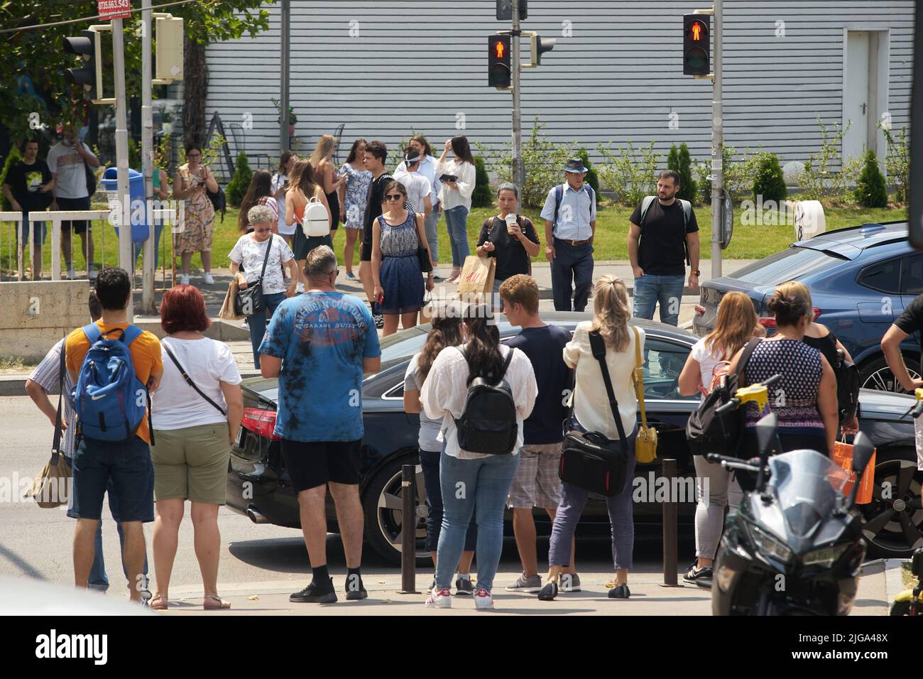 Bucharest, Romania - July 05, 2022: People are crossing the street in ...