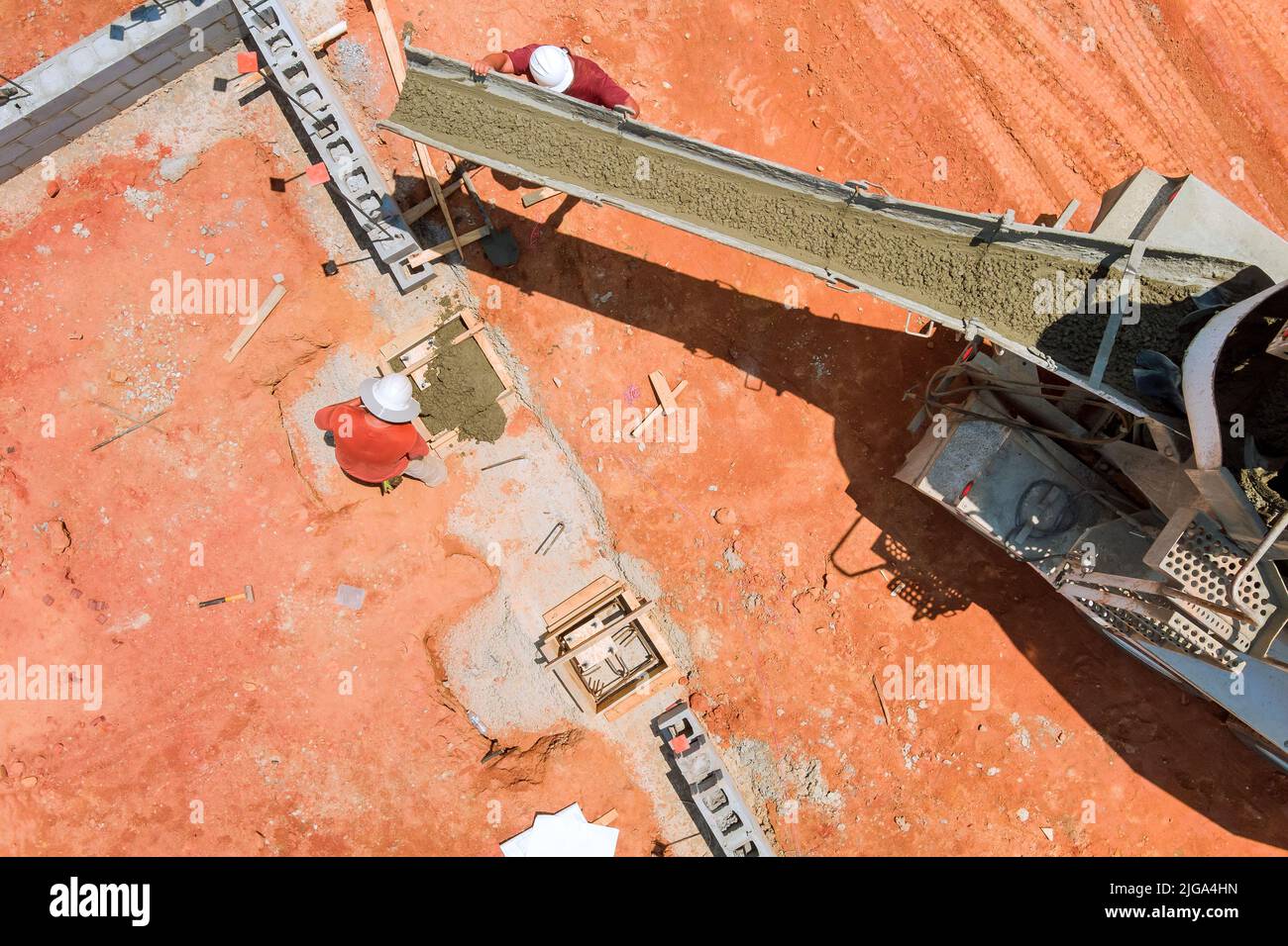 The pouring of concrete columns on a construction site, an aerial view ...