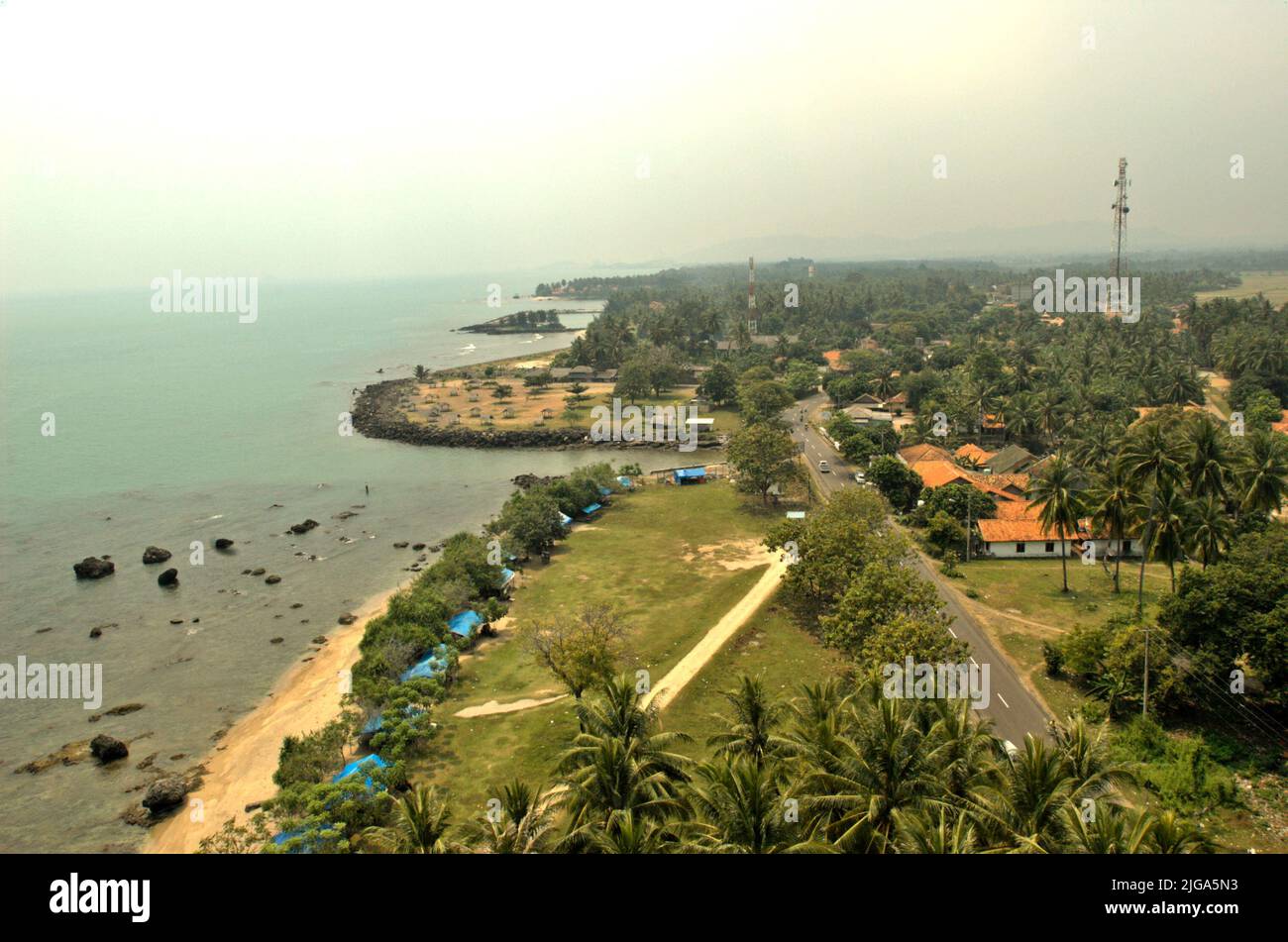 Anyer coastline and a coastal road are seen from Cikoneng Lighthouse ...