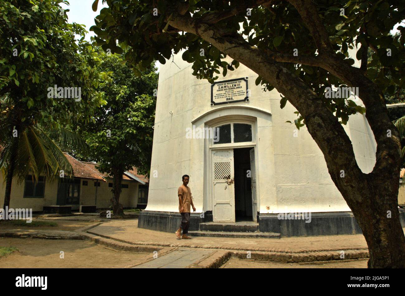 A man walking past the entrance of Cikoneng Lighthouse (Anyer ...