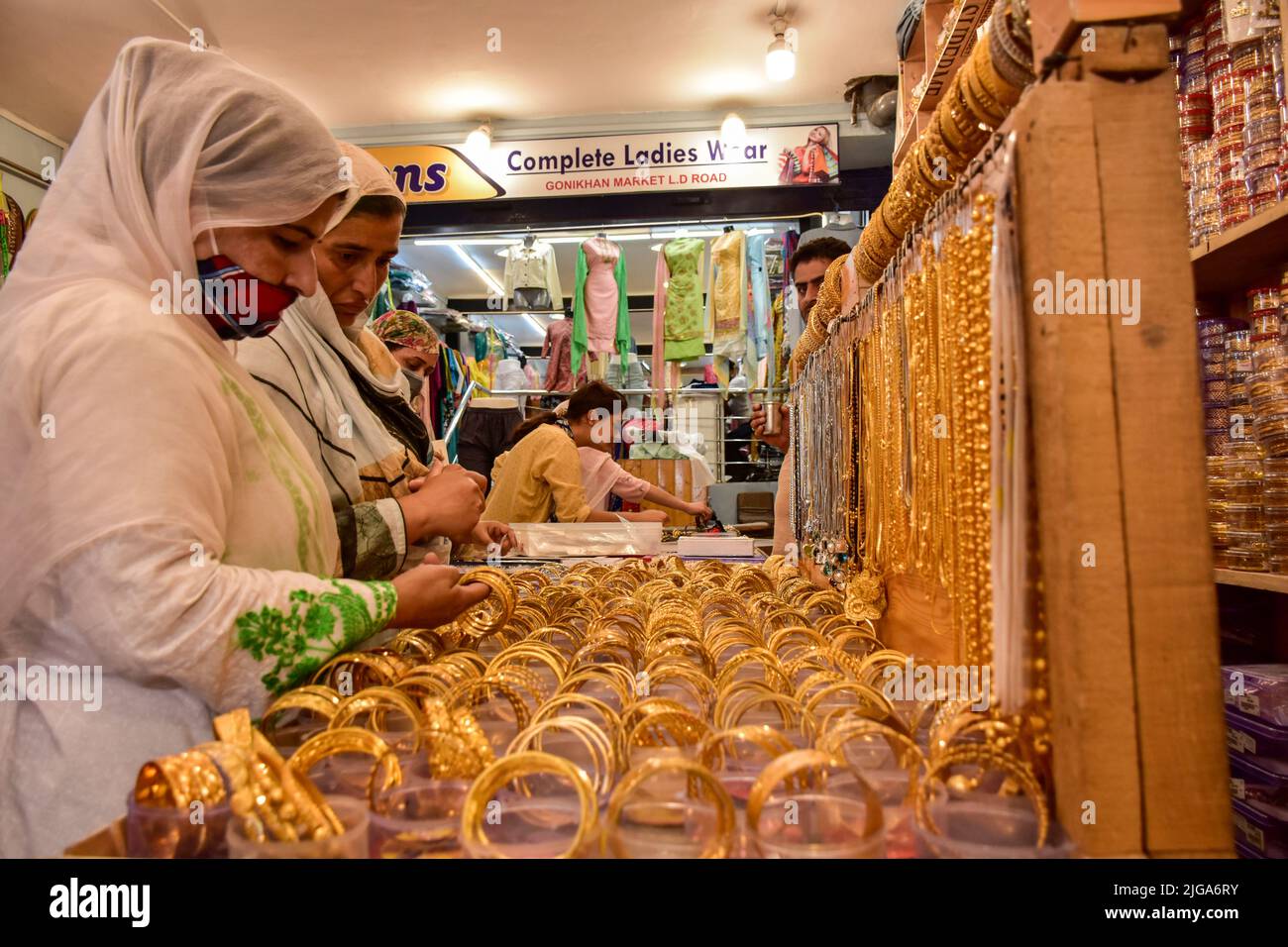 Kashmiri women shop at a jewelry store ahead of the Muslim festival Eid ...