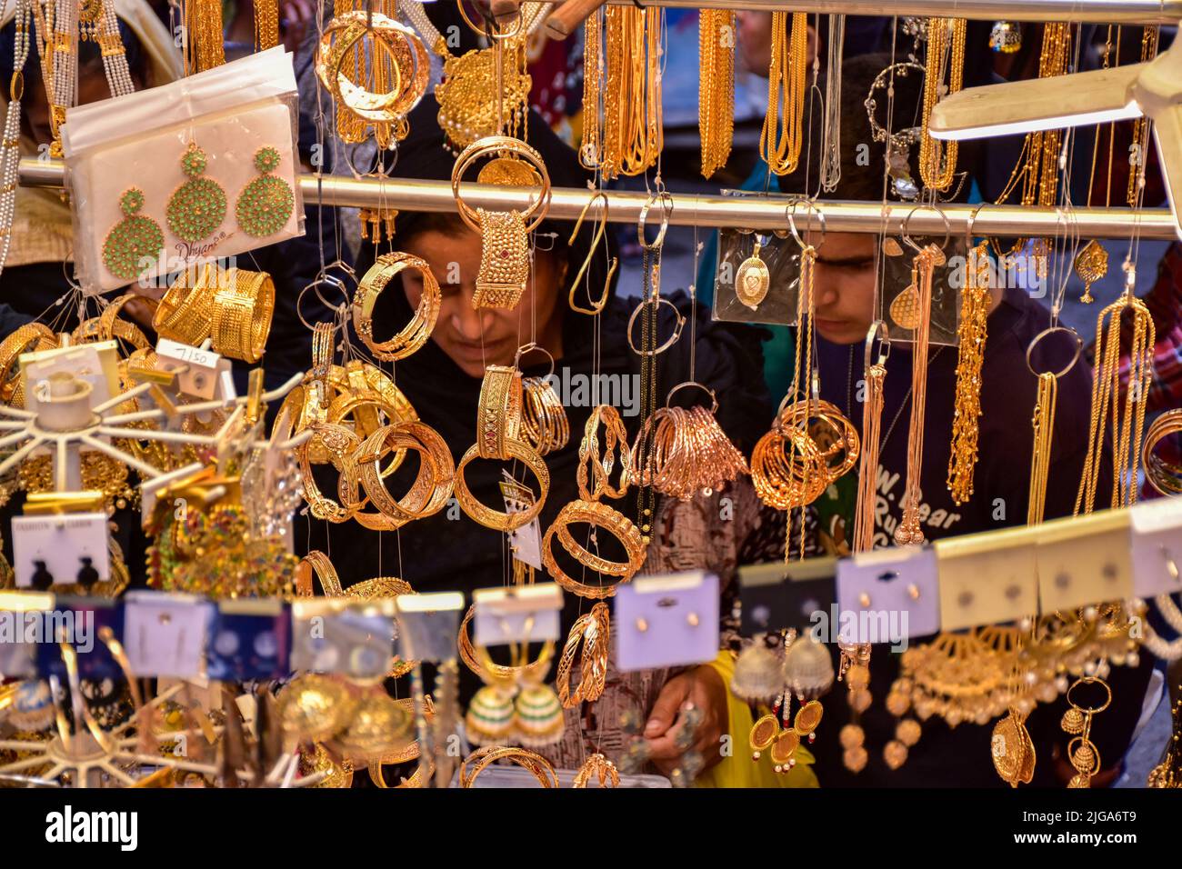 Srinagar, India. 08th July, 2022. A Kashmiri woman shops at a jewelry ...