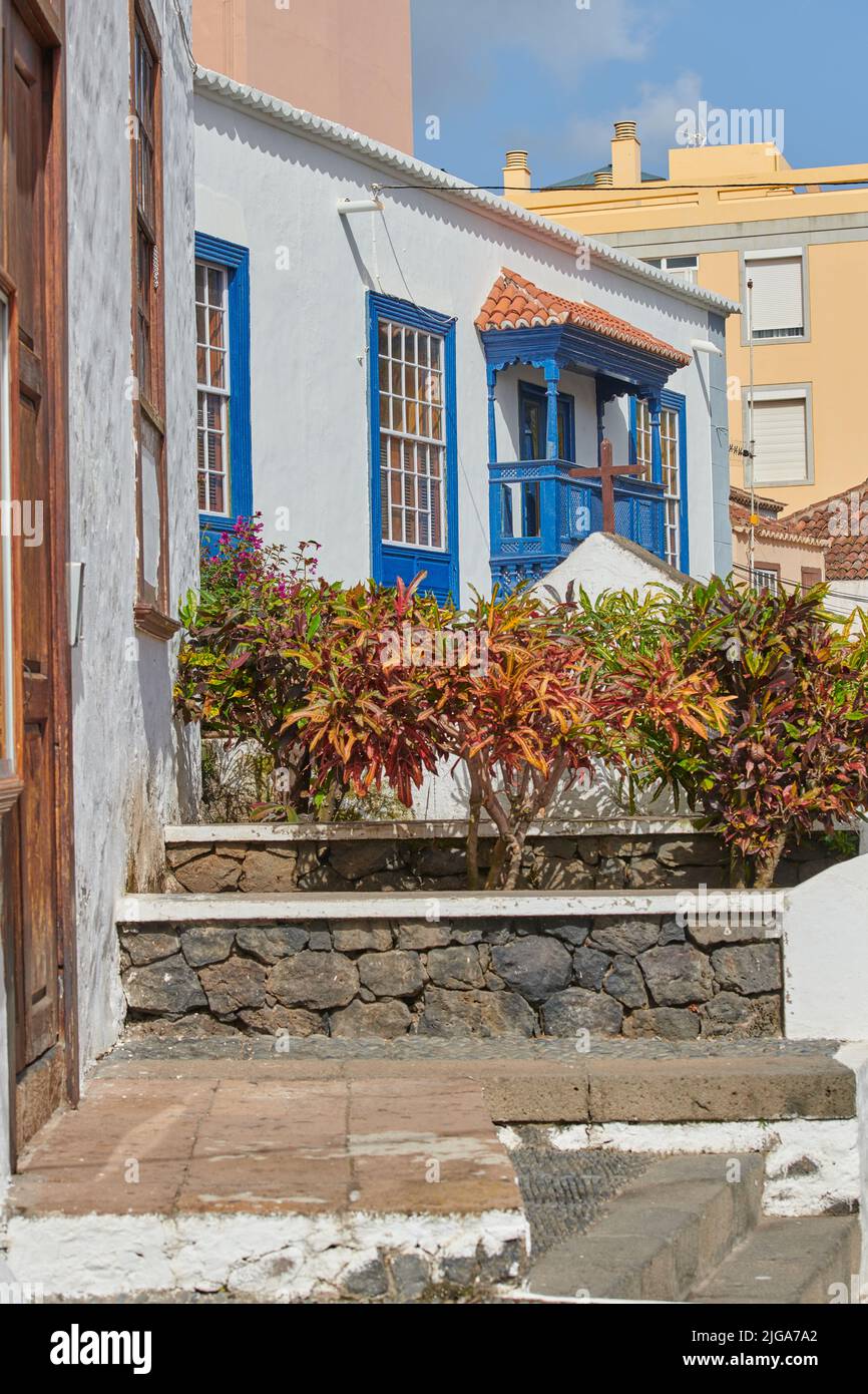 Classic building with flowers and plants at the entrance in the city of ...