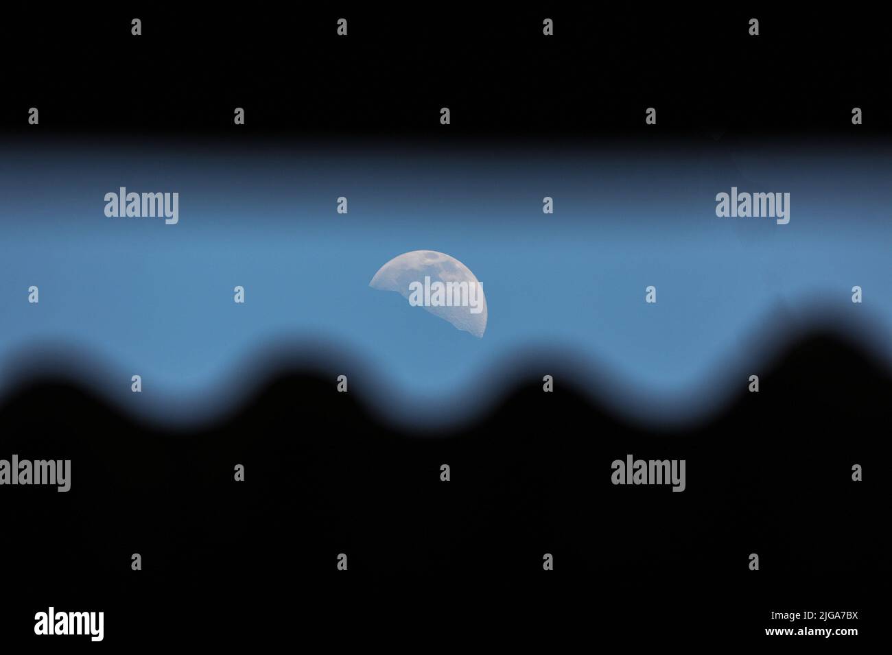 Gaza, Palestine. 08th July, 2022. The "first quarter moon" appears over ...