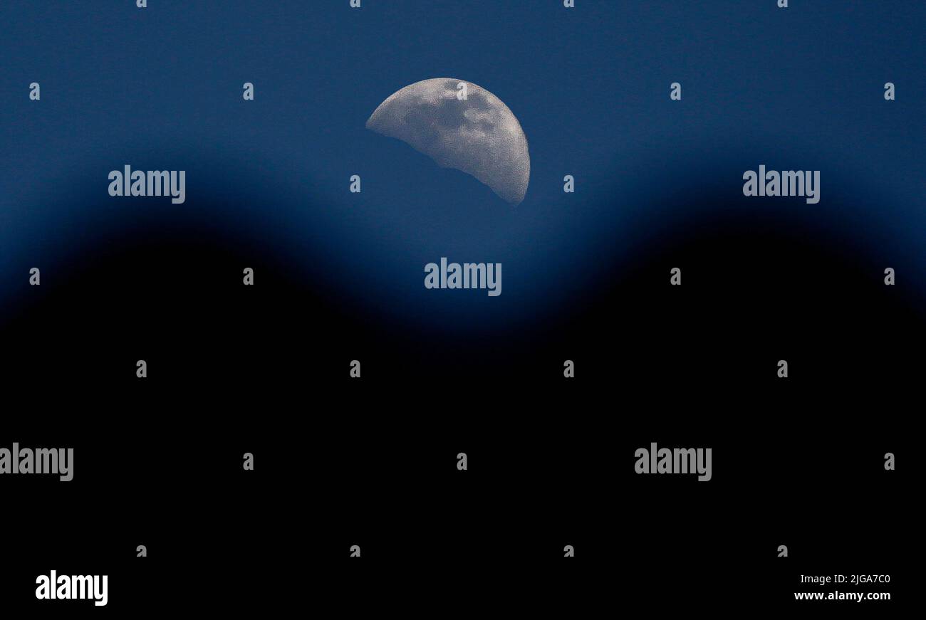 Gaza, Palestine. 08th July, 2022. The "first quarter moon" appears over ...