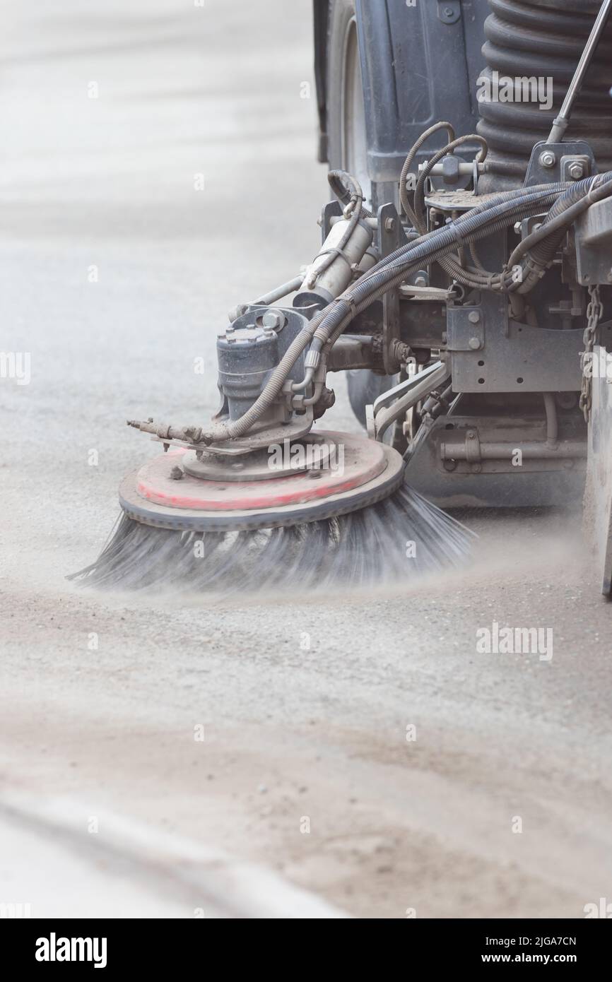 Machine clears the asphalt with a sweeper Stock Photo - Alamy