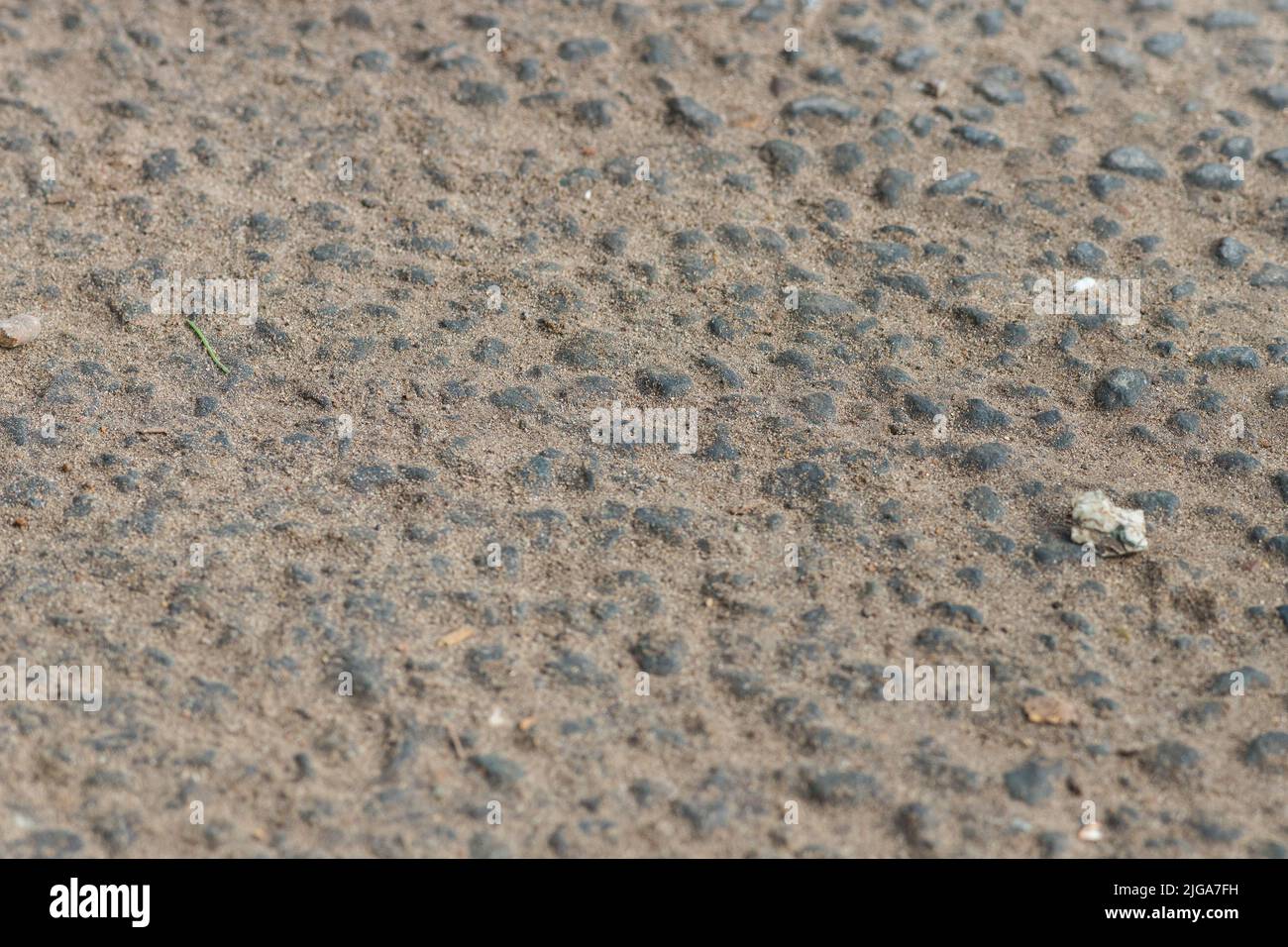 Light grey asphalt texture with small rocks in it Stock Photo - Alamy