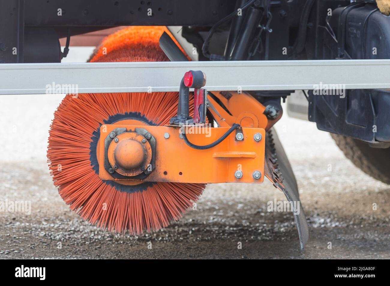 Cleaning the road asphalt with a sweeper Stock Photo - Alamy