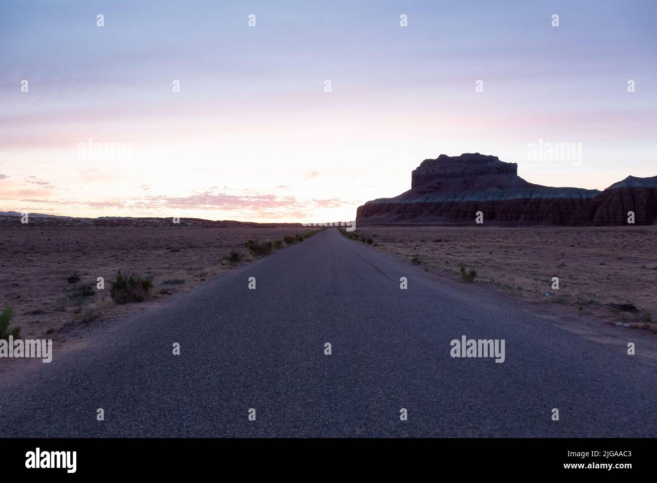 Scenic Road in Rocky Mountains in the Desert at Sunrise Stock Photo - Alamy
