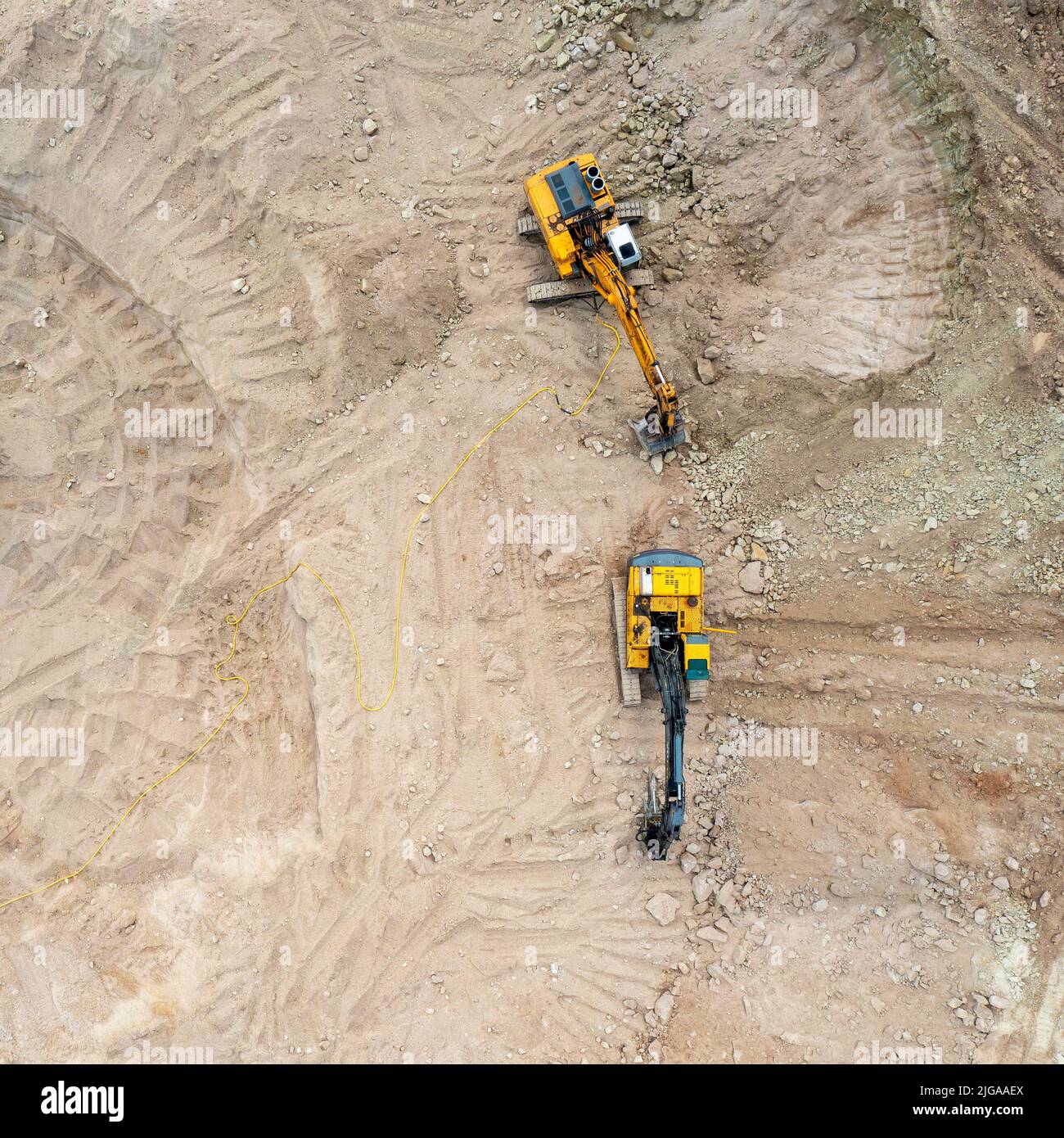 Aerial photo of excavator on industrial place. Industrial site top view ...