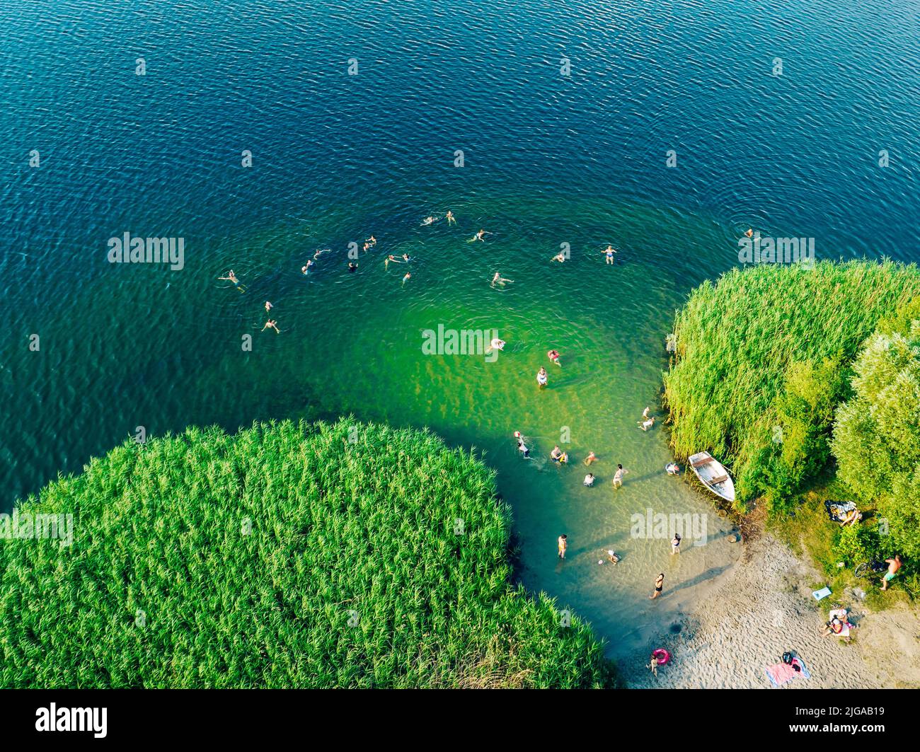 Summer time at the lake. Rest on the beach. Aerial view of small hidden ...