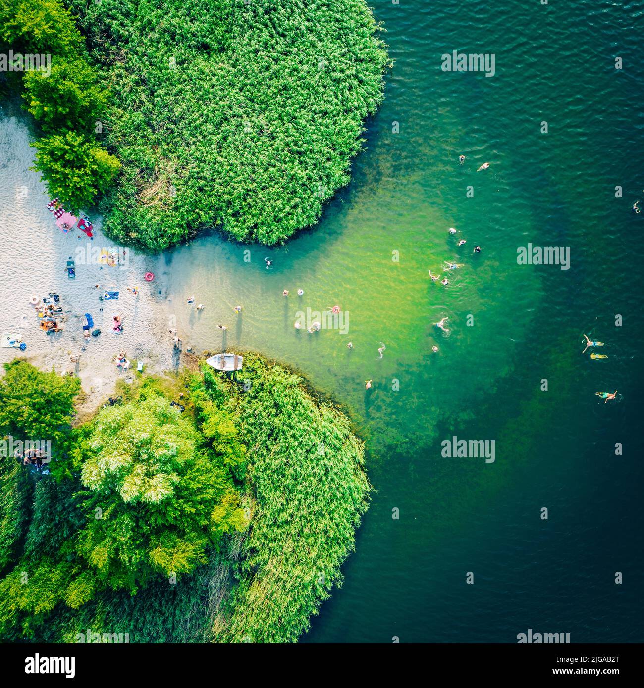 Summer time at the lake. Rest on the beach. Aerial view of small hidden ...