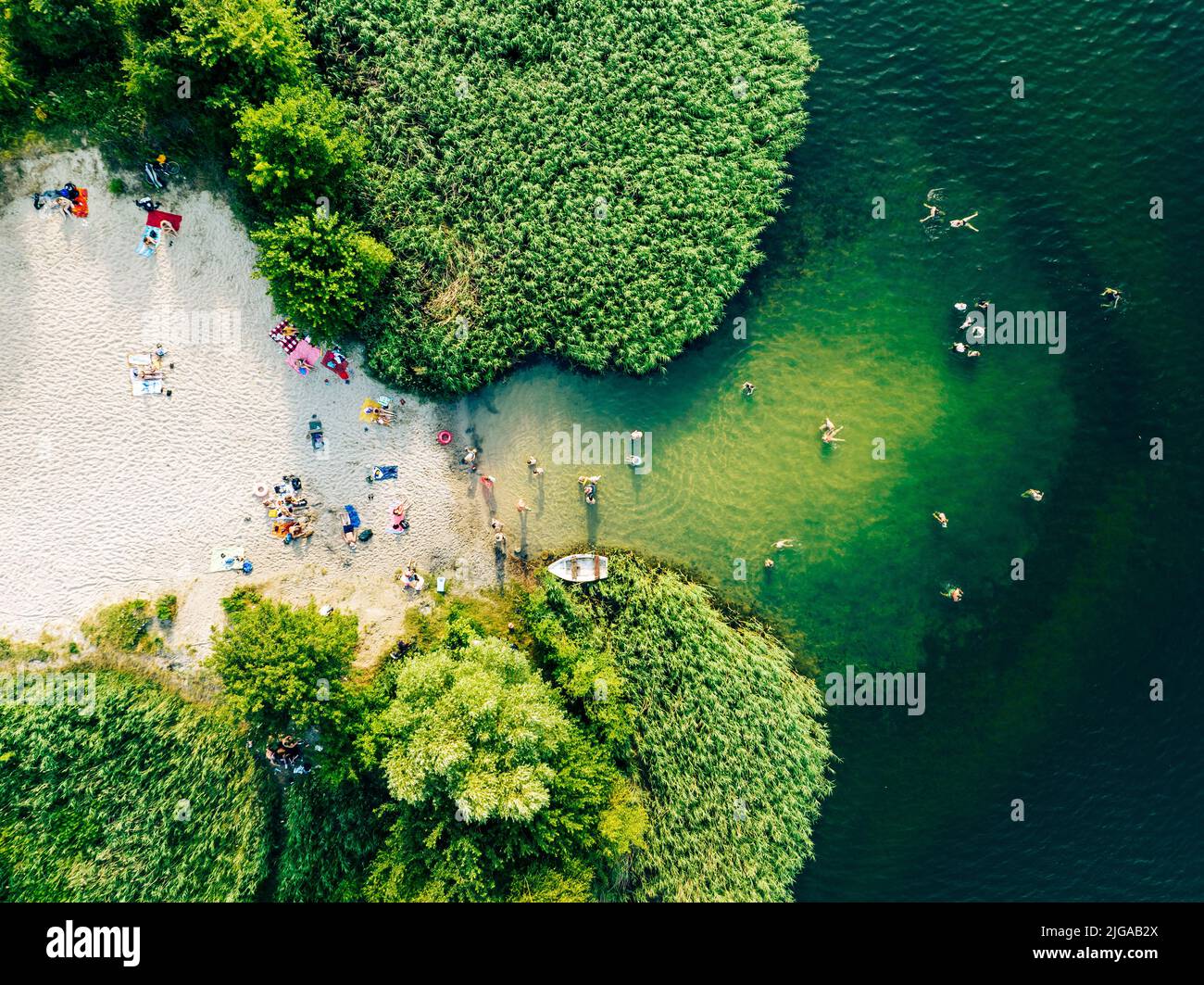 Summer time at the lake. Rest on the beach. Aerial view of small hidden ...