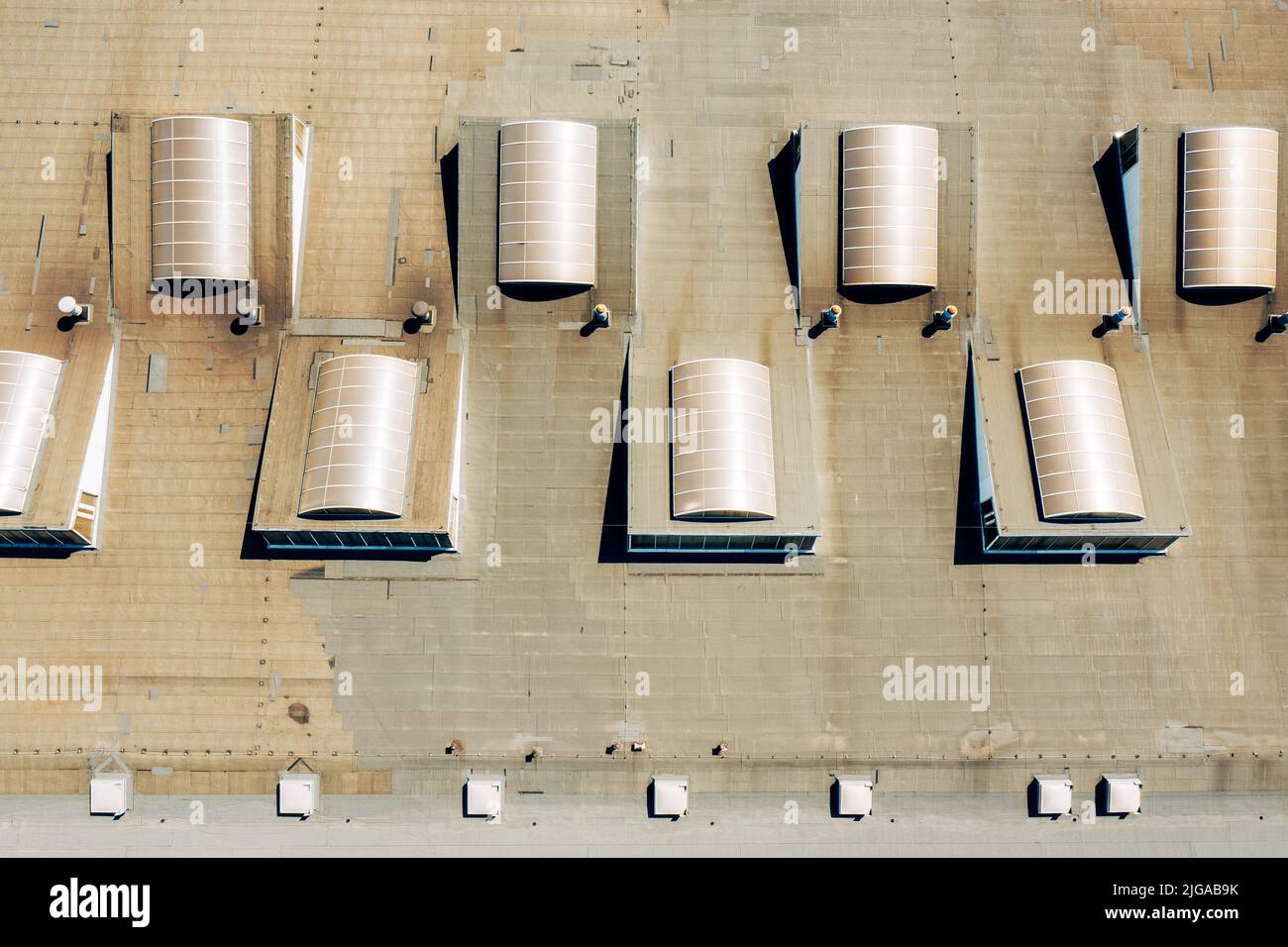 Industrial. Aerial view of large roof of factory. Drone shot from above ...