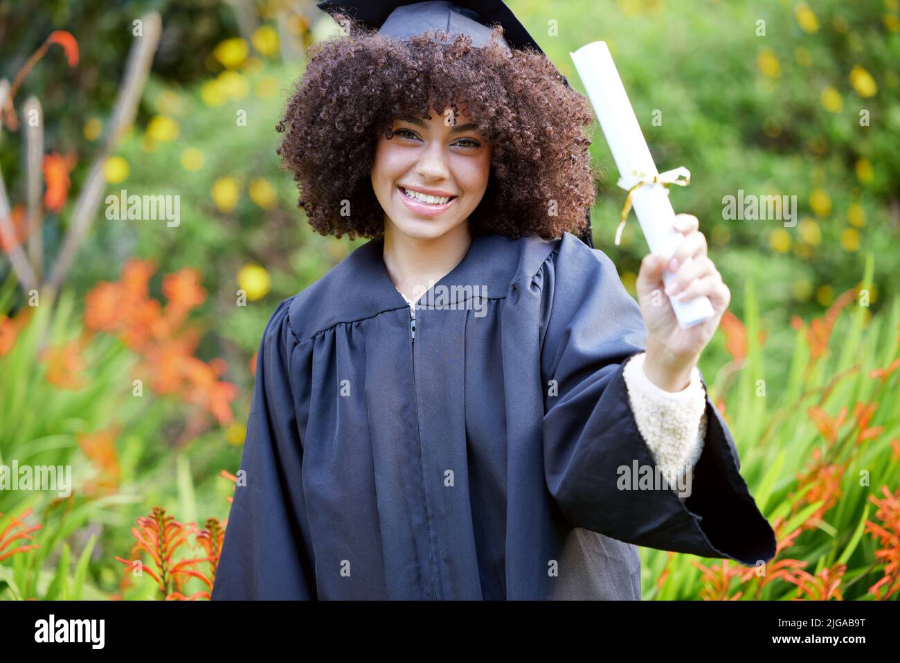 Im qualified now. a beautiful young woman holding her diploma on ...