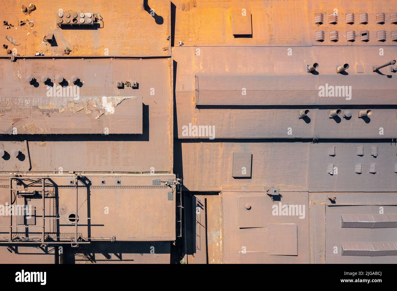 Industrial. Aerial view of large roof of factory. Drone shot from above ...