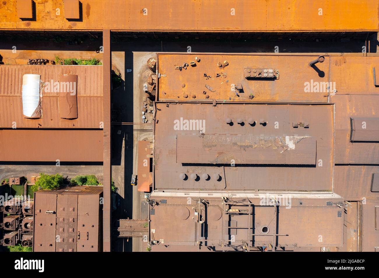 Industrial. Aerial view of large roof of factory. Drone shot from above ...