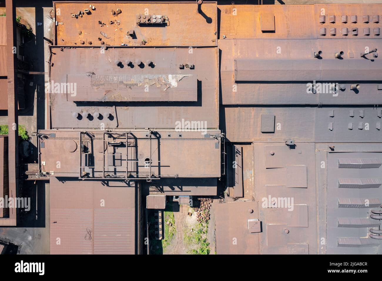 Industrial. Aerial view of large roof of factory. Drone shot from above ...