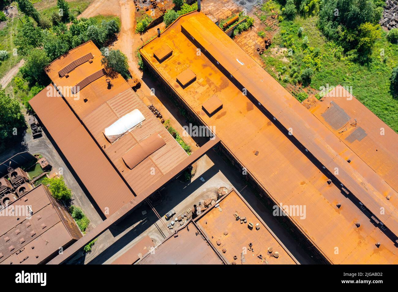 Industrial. Aerial view of large roof of factory. Drone shot from above ...