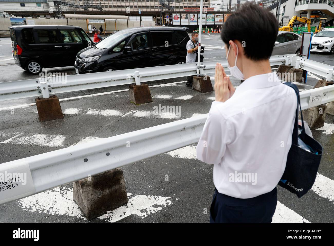 Nara, Nara, Japan. 9th July, 2022. A man offers a silent prayer at the ...