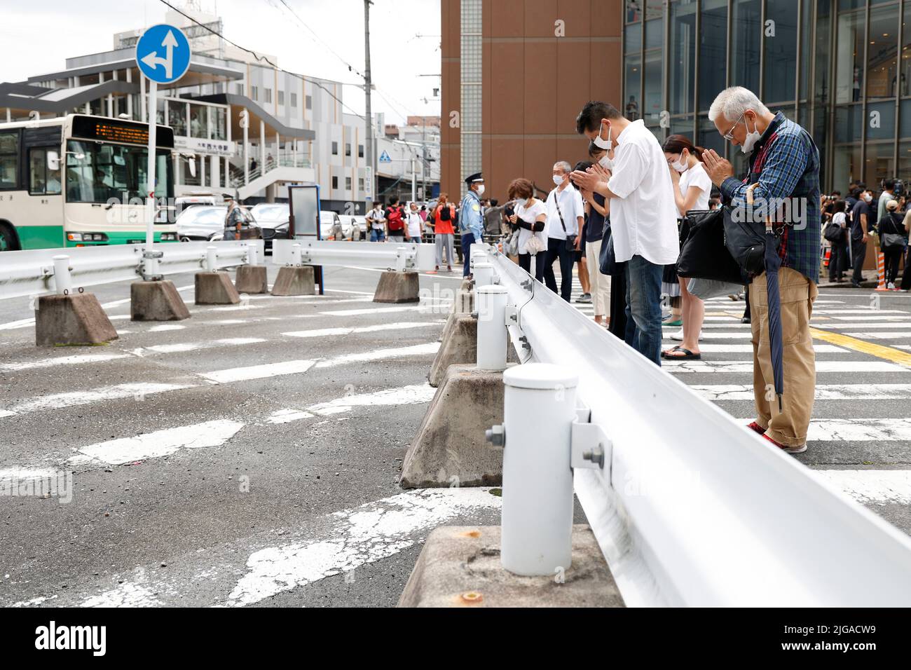Nara, Nara, Japan. 9th July, 2022. People wearing face masks offer a ...