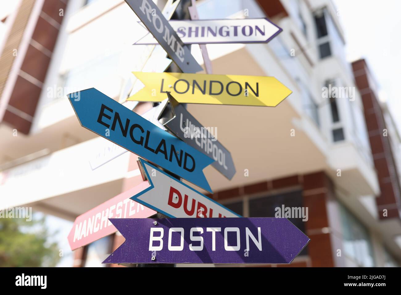 Road sign with pointers of different cities and countries Stock Photo ...