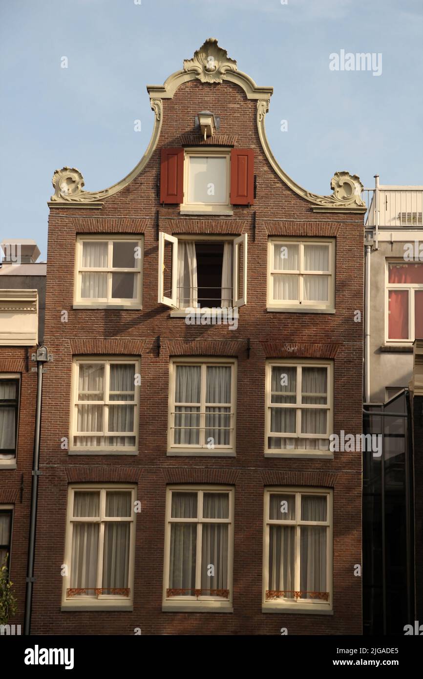 An outdoor view of an old building in Amsterdam, Netherlands at night ...