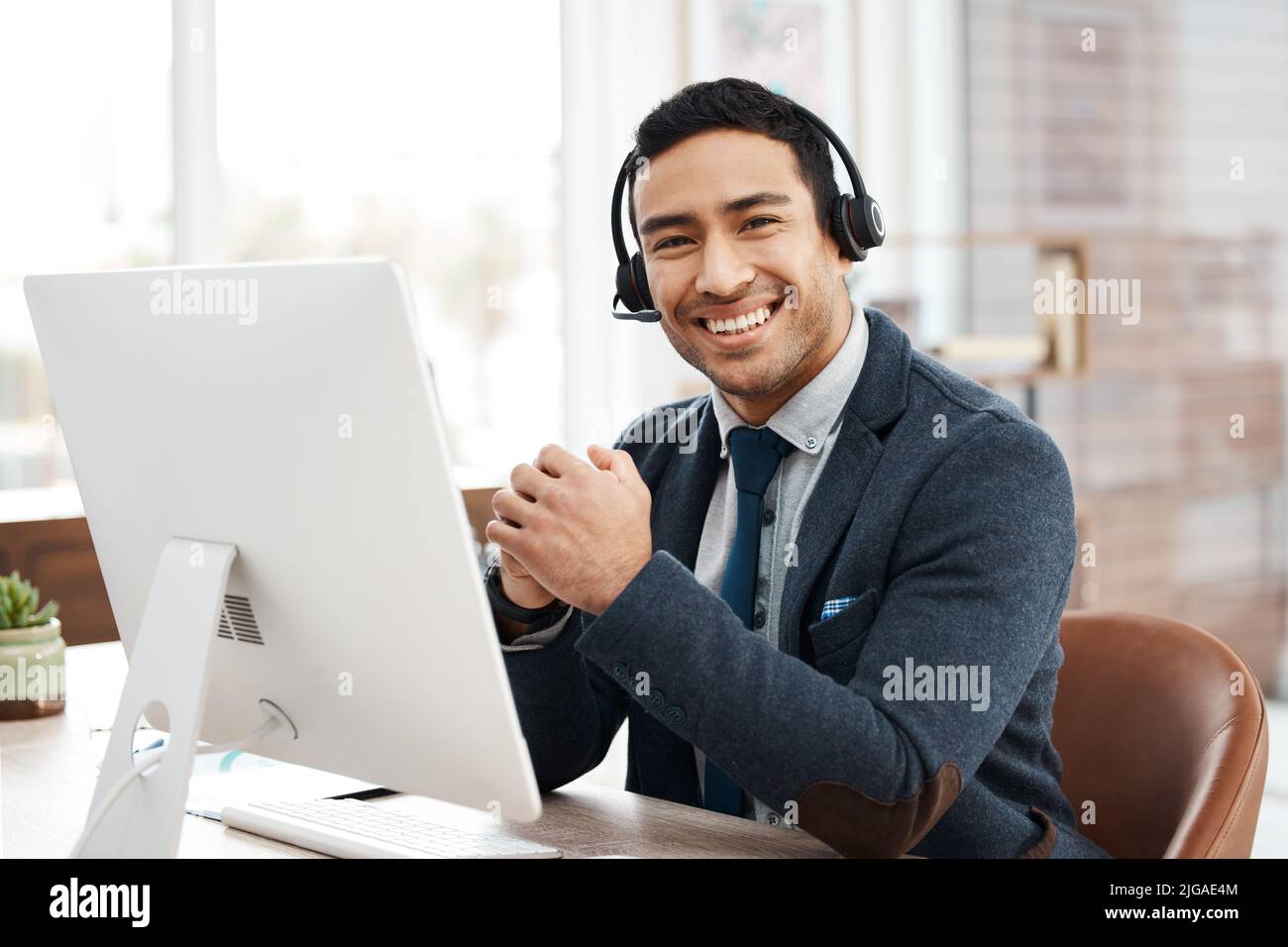 The most friendly call center agent. a young male call center agent ...