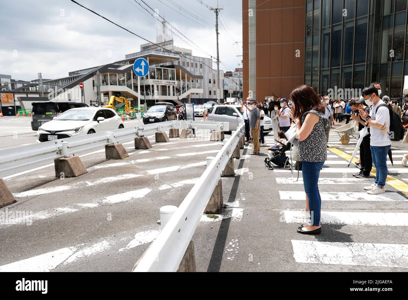 Nara, Nara, Japan. 9th July, 2022. People wearing face masks offer a ...