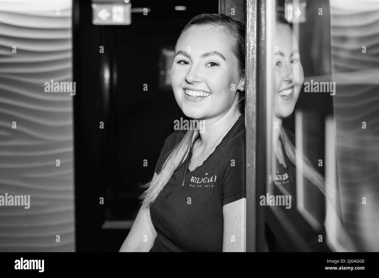 A grayscale portrait of a female on a party at a bar in Sheffield, UK ...