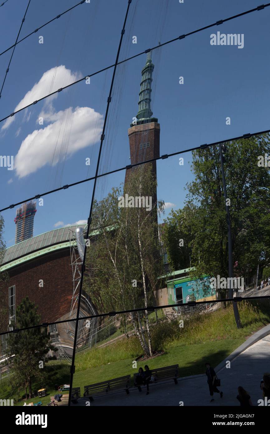 The surrounding buildings reflected in the mirror glass of the Depot ...