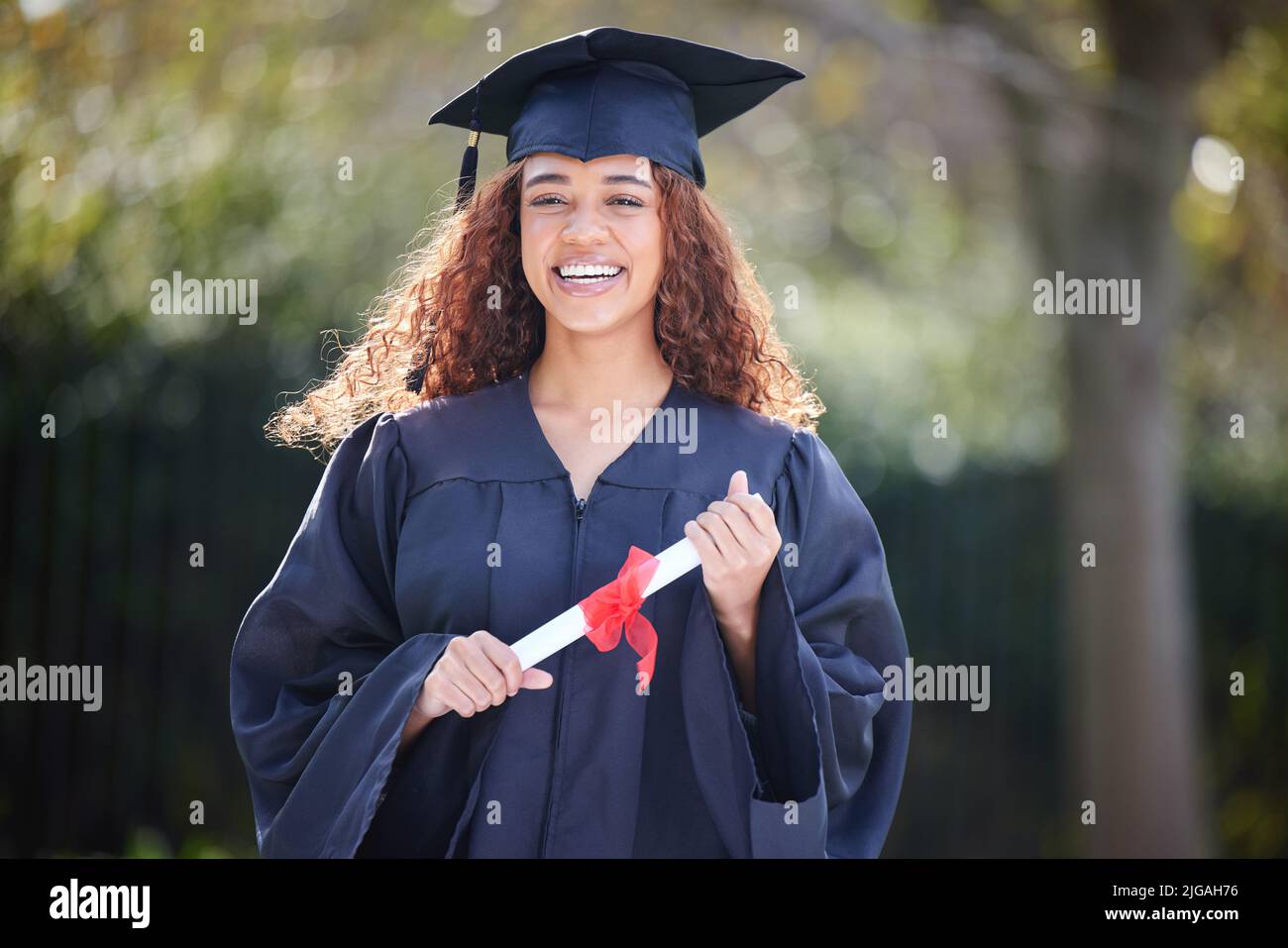 Go forth and set the world on fire. Portrait of a young woman holding ...