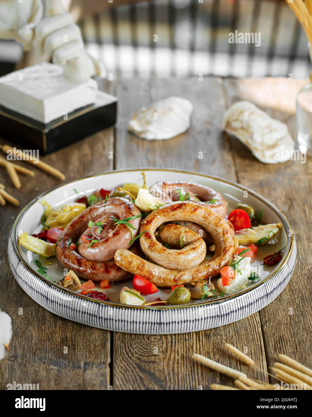 Side view on portion of grilled sausages Stock Photo - Alamy