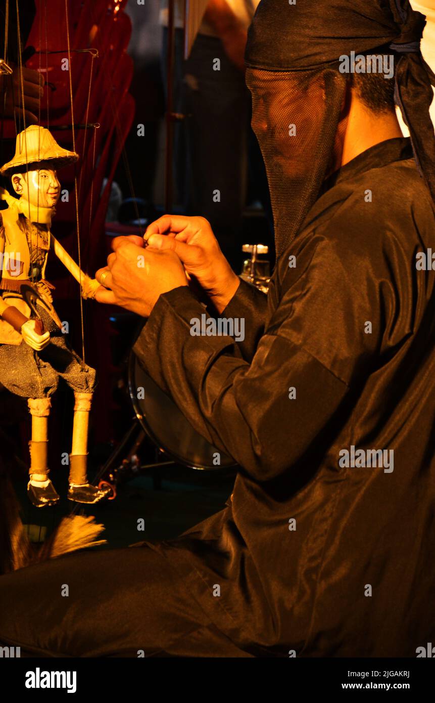 Thai professional puppeteer or Puppet master manipulate playing acting ...