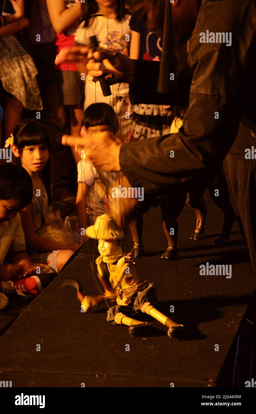 Thai professional puppeteer or Puppet master manipulate playing acting ...