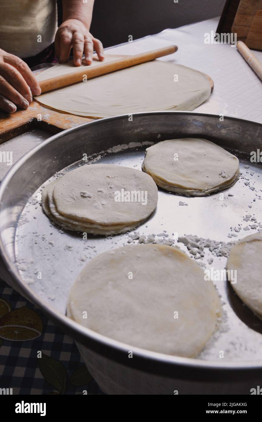 Close up of female hands preparation of dough for Baklava, homemade ...