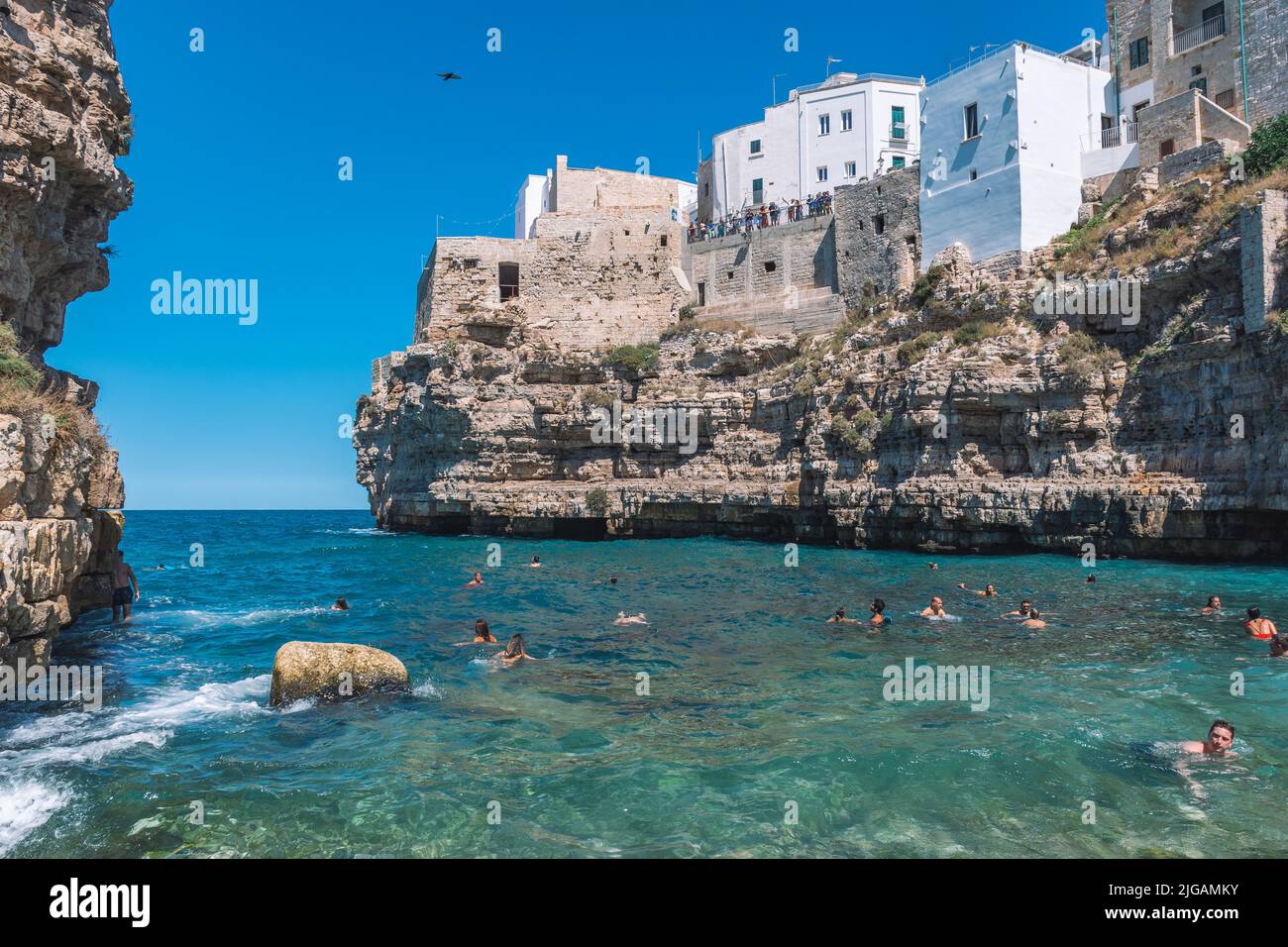 Beautiful view of Polignano a Mare with white stone houses, cliff ...