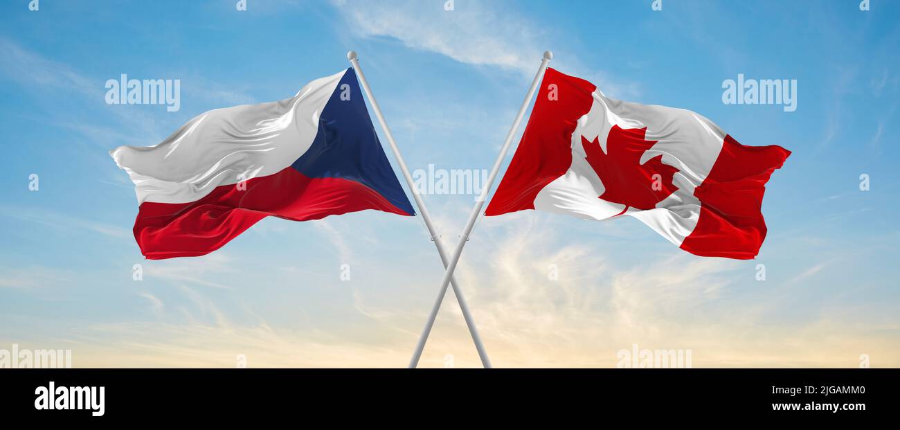 two crossed flags canada and Czech republic waving in wind at cloudy ...