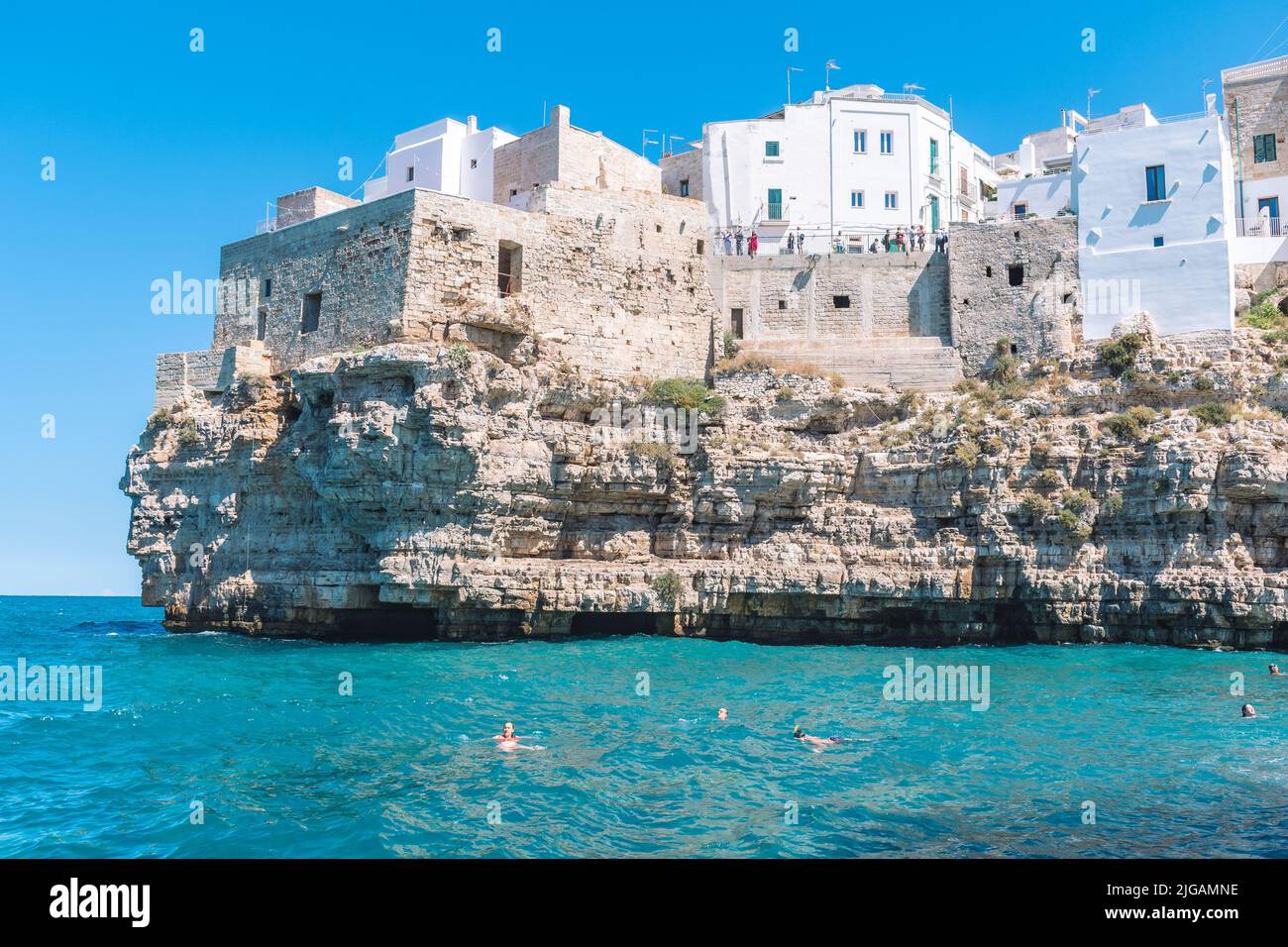 Beautiful view of Polignano a Mare with white stone houses, cliff ...