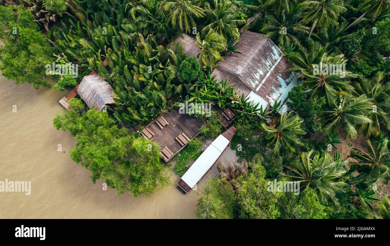 aerial top down view of local home along tropical jungle of mekong ...