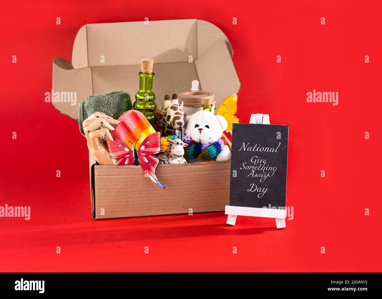 Concept for National Give Something Away Day. Various toys and gifts in ...