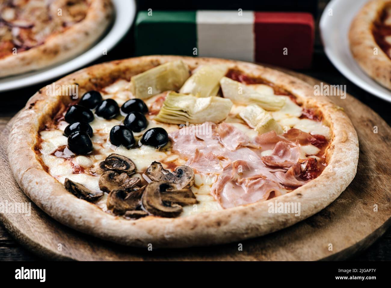 A Quattro stagioni Italian pizza.Four season pizza close up Stock Photo ...